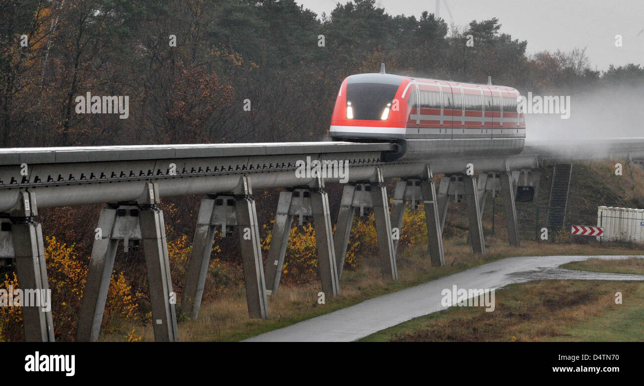 A ?Transrapid 09? maglev train driving at full speed on the test track ...