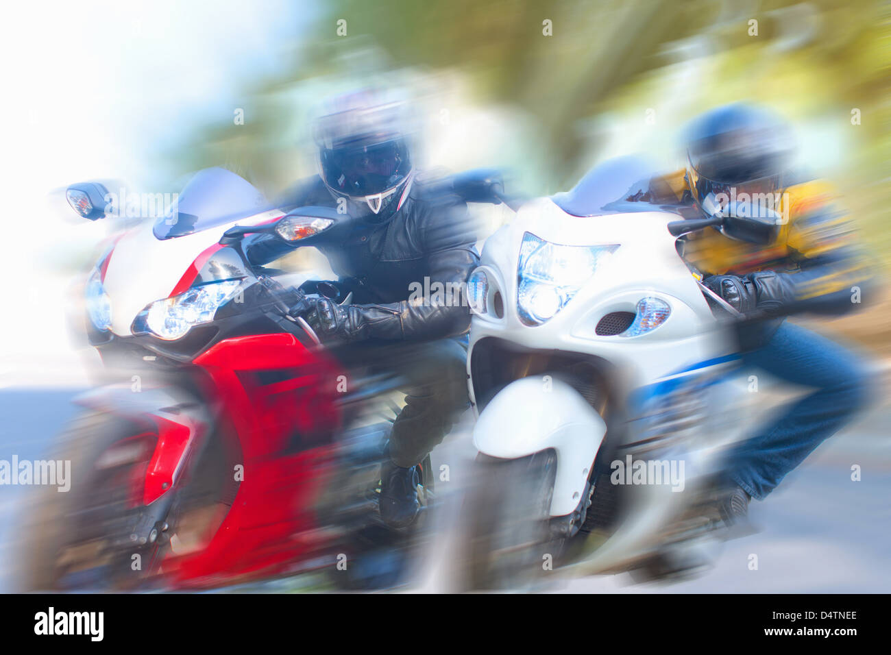 Blurred view of men riding motorcycles Stock Photo - Alamy