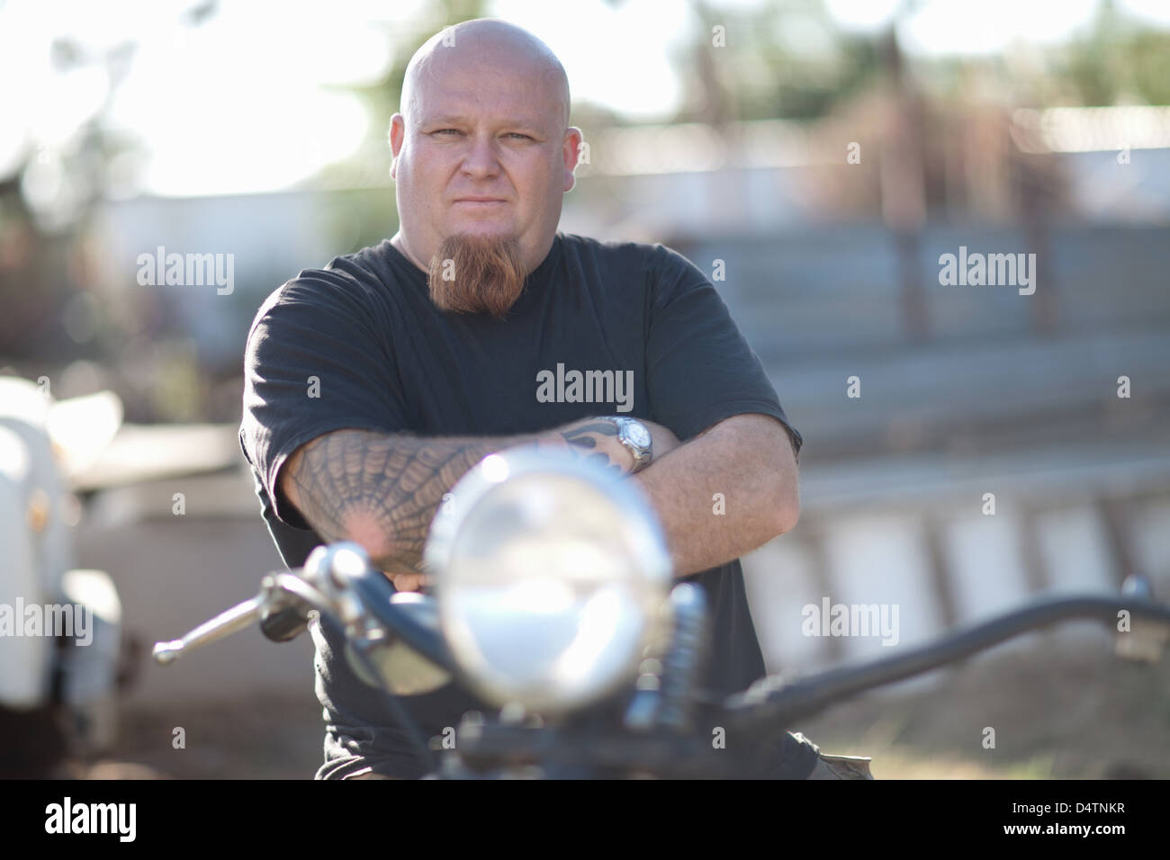 Man sitting on motorcycle Stock Photo - Alamy
