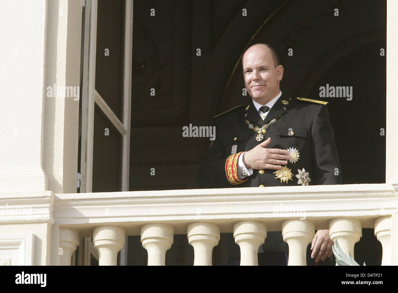 Prince Albert II of Monaco smiles on a balcony during the Army Parade ...