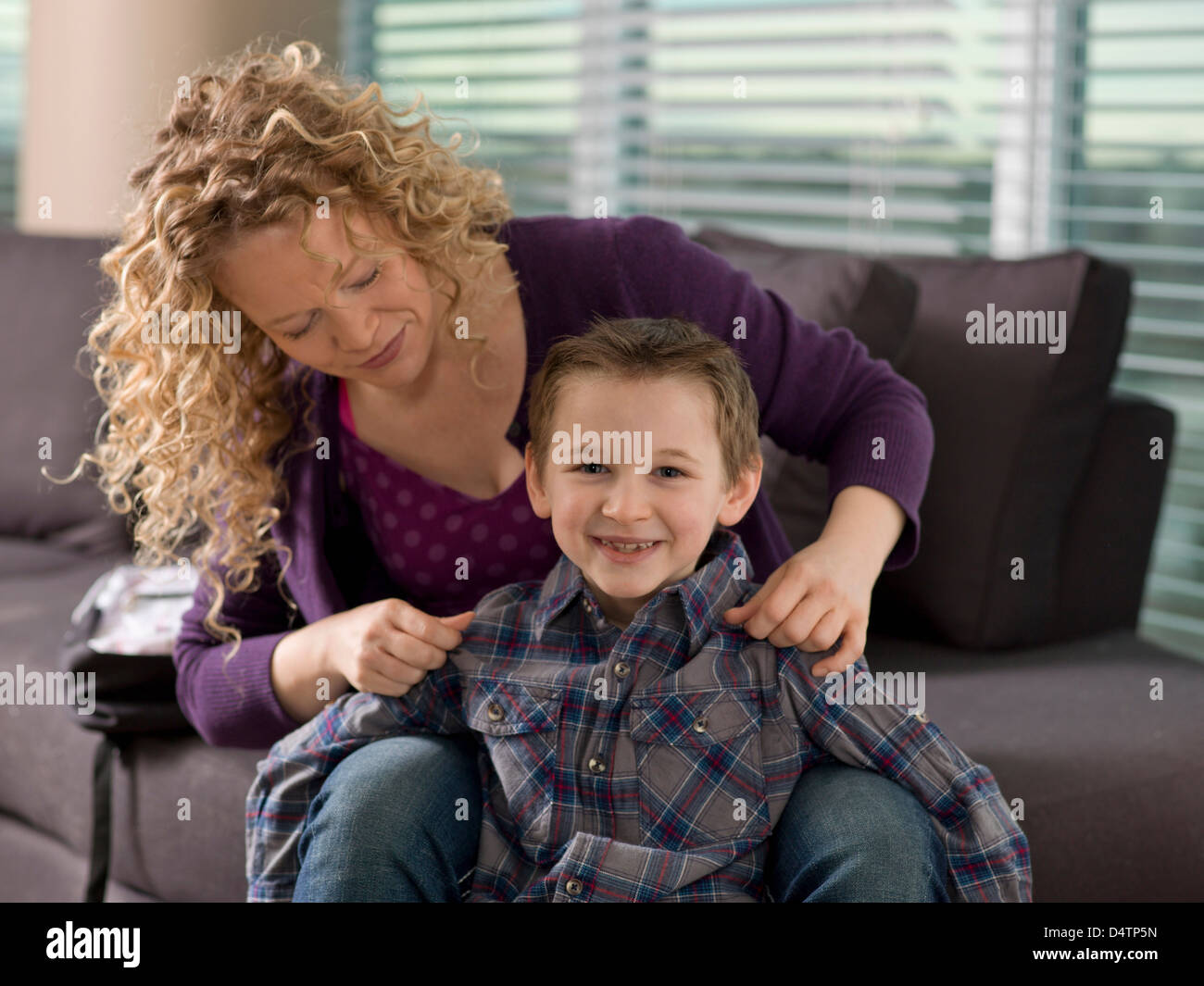 Mother and son smiling together Stock Photo - Alamy