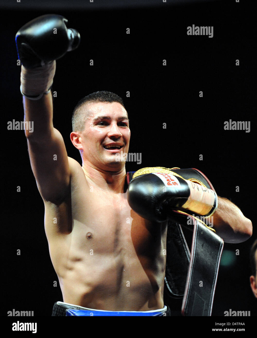 German boxer Dimitri Sartison celebrates his victory in the WBA super ...