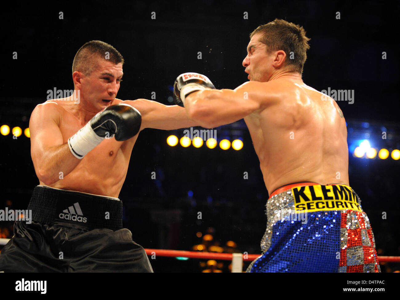 German boxer Dimitri Sartison (L) fights against Croatian Stjepan Bozic ...