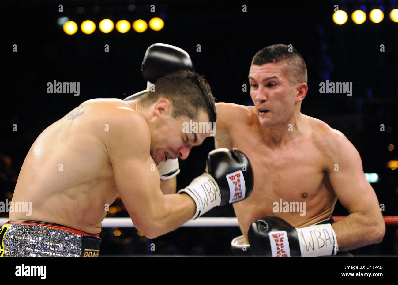 German boxer Dimitri Sartison (R) fights against Croatian Stjepan Bozic ...