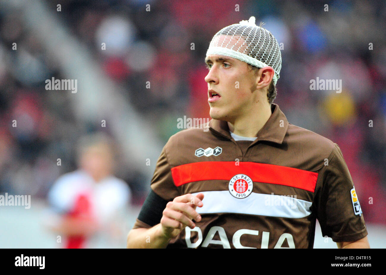 Max Kruse of St Pauli wearing a head protection in action during the ...