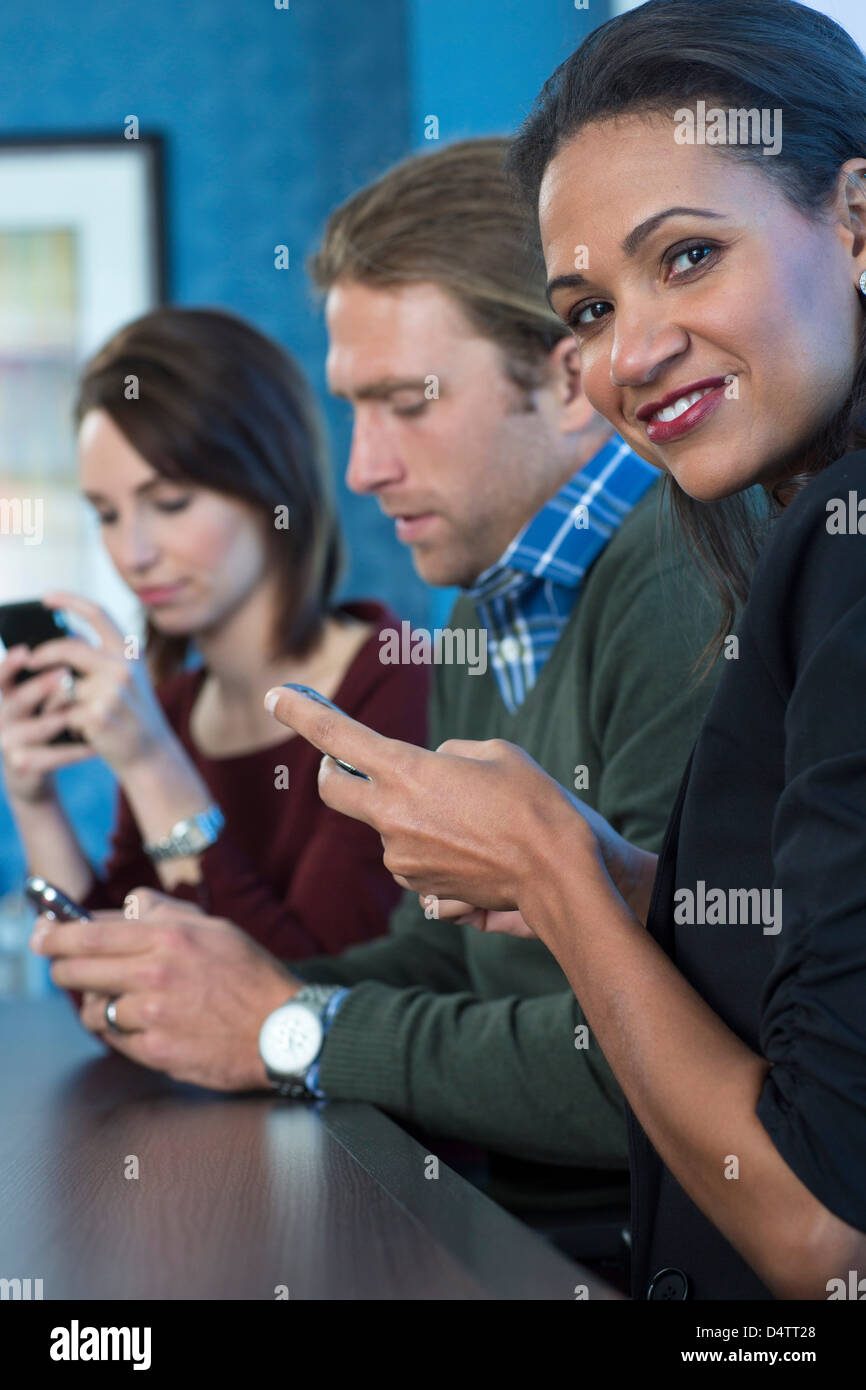 Business people using cell phones Stock Photo - Alamy