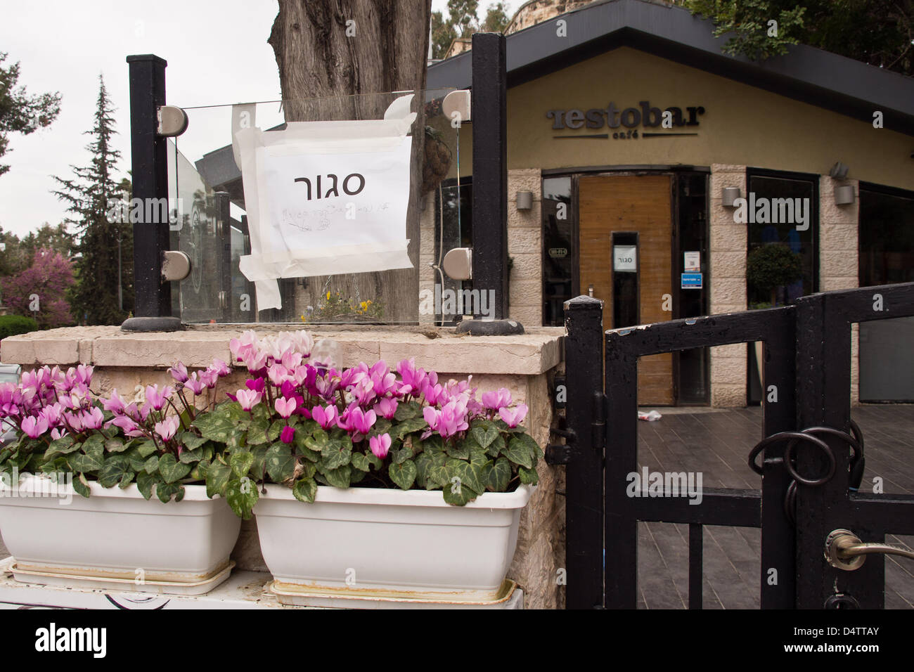 A Hebrew sign notifies customers the Restobar is closed. Shachar Levi ...