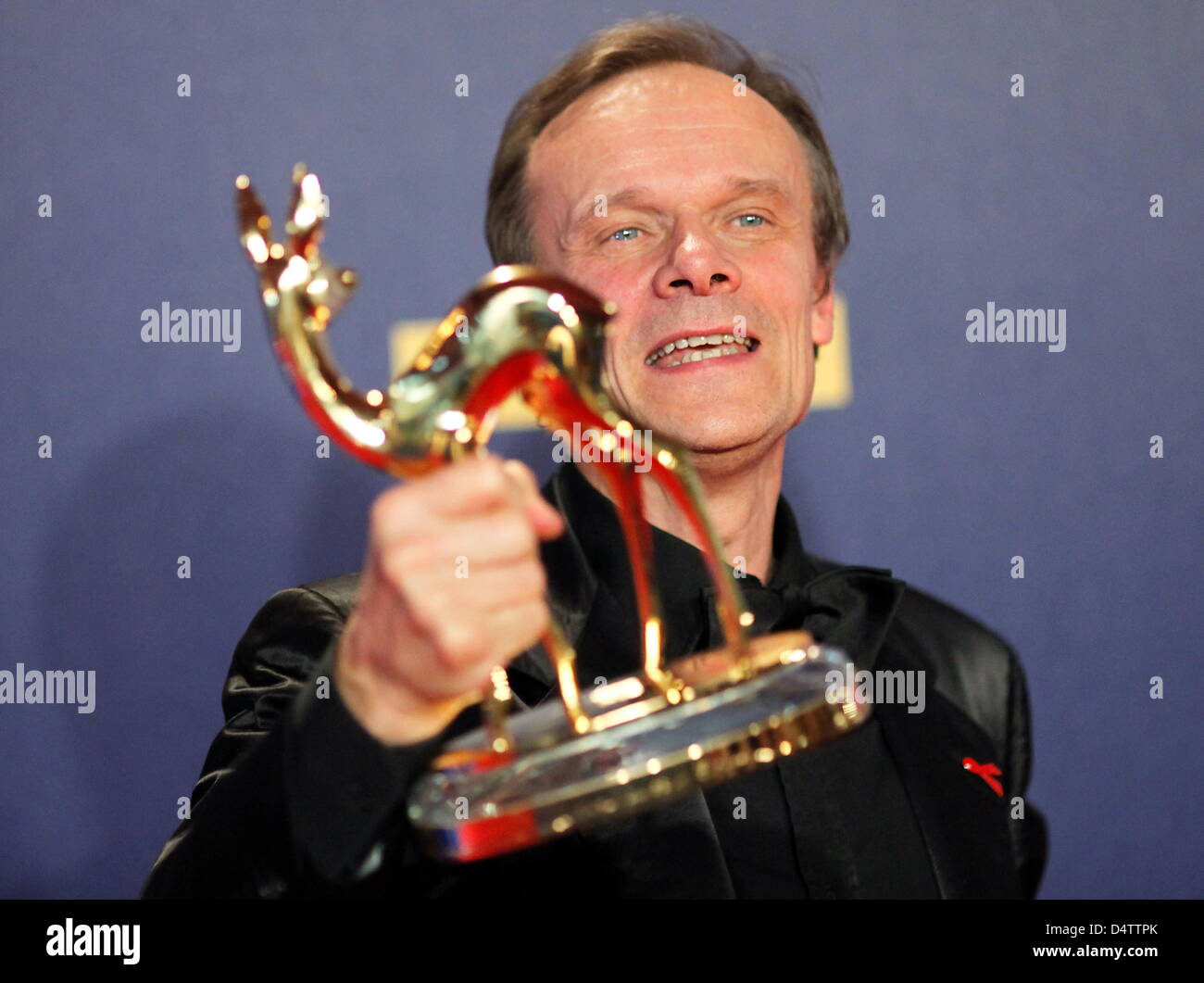 German actor Edgar Selge poses with his Bambi award at the Bambi 2009 ...