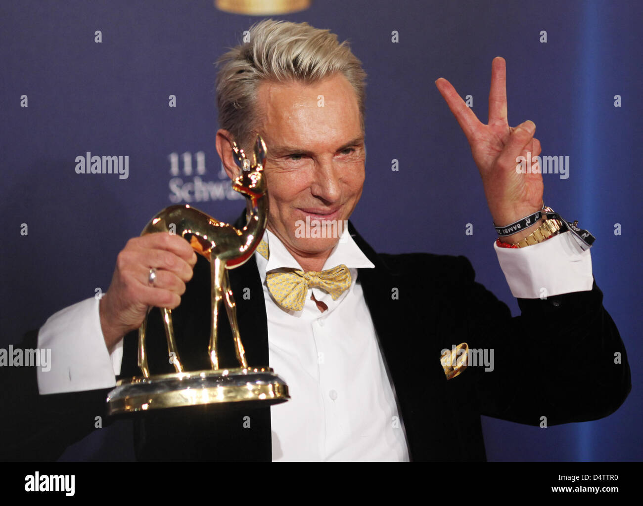 German designer Wolfgang Joop smiles with his Bambi 2009 award at the ...