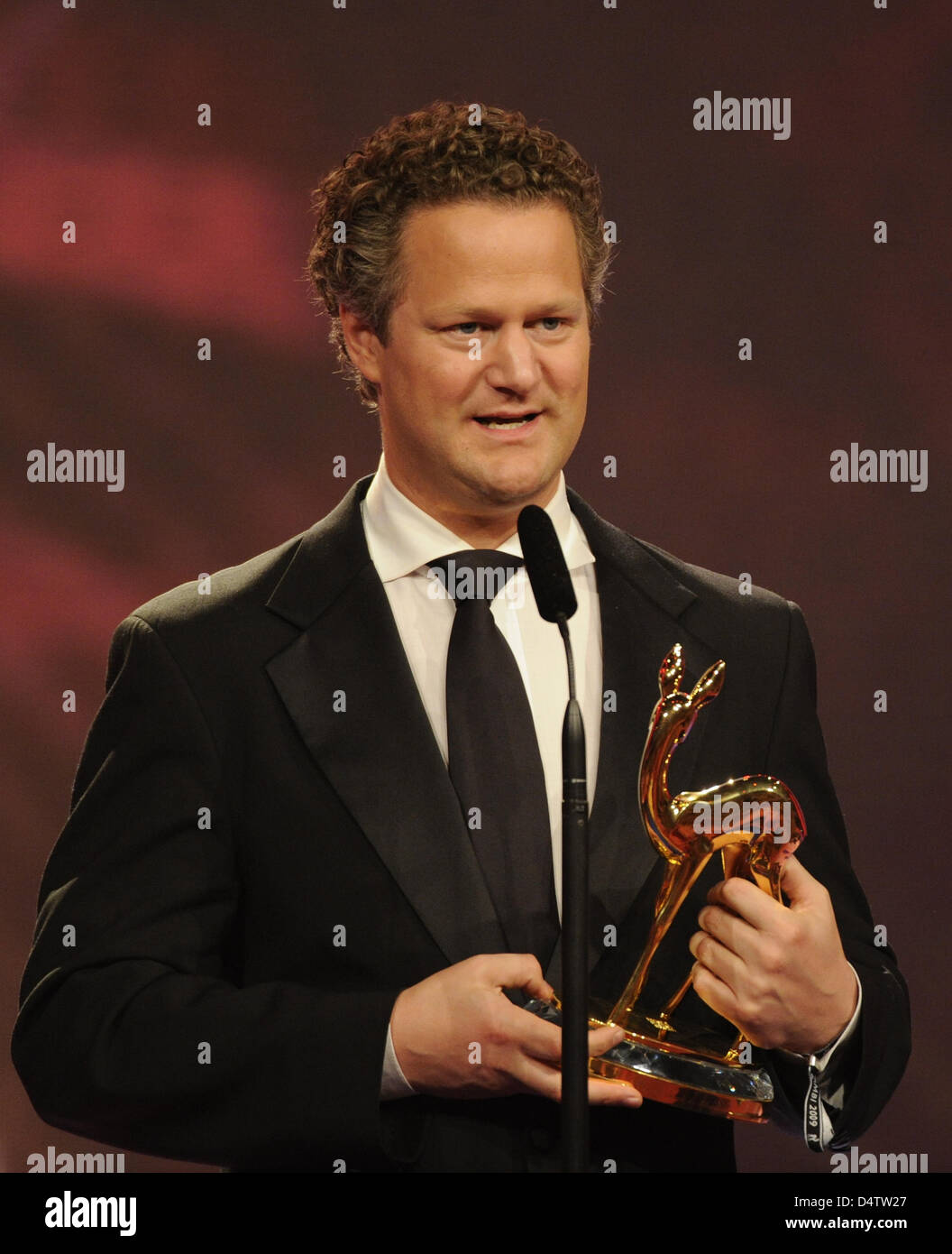German filmmaker Florian Henckel von Donnersmarck smiles with his Bambi ...