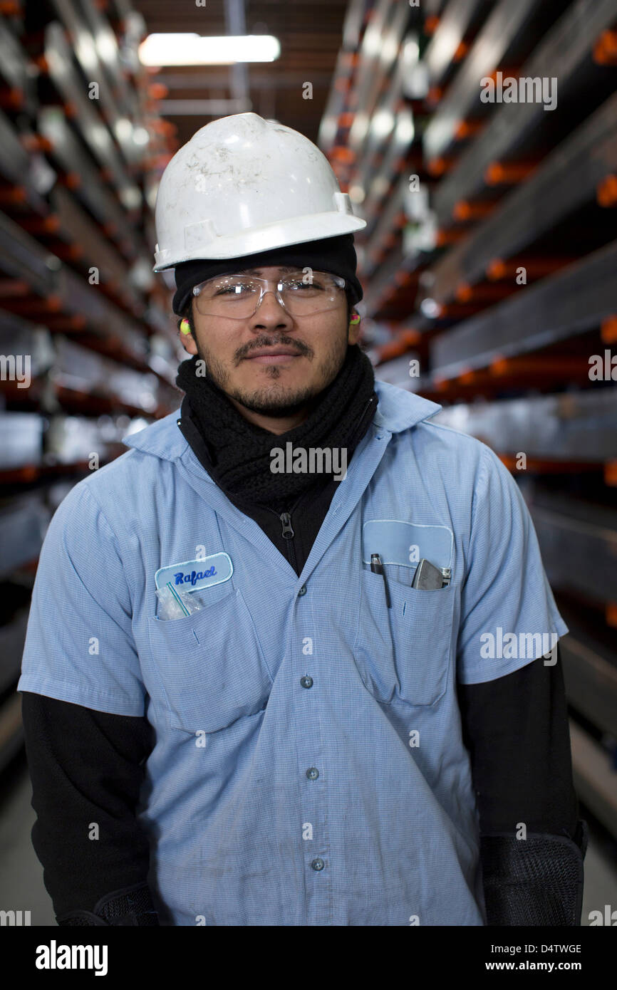 Smiling worker in manufacturing plant hi-res stock photography and ...