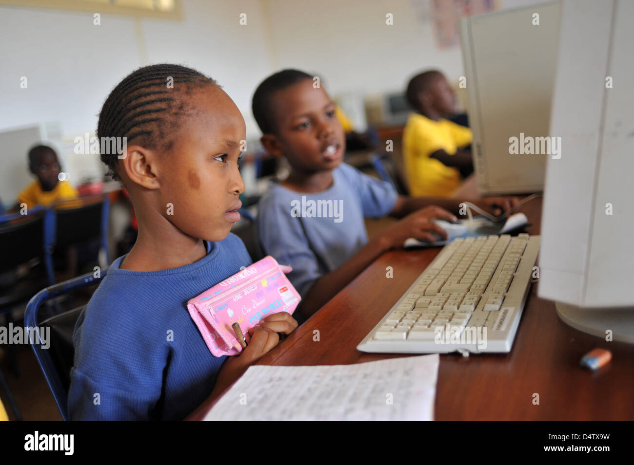 Pupils of Kip Keino High School attend their computer sciences class in ...