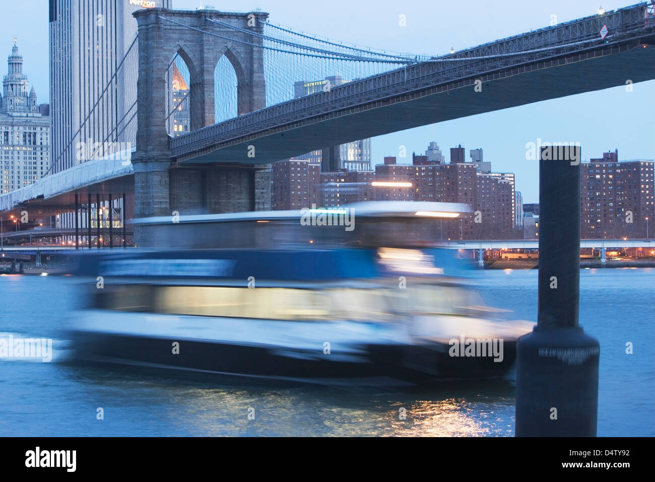 Blurred view of boat on urban river Stock Photo - Alamy