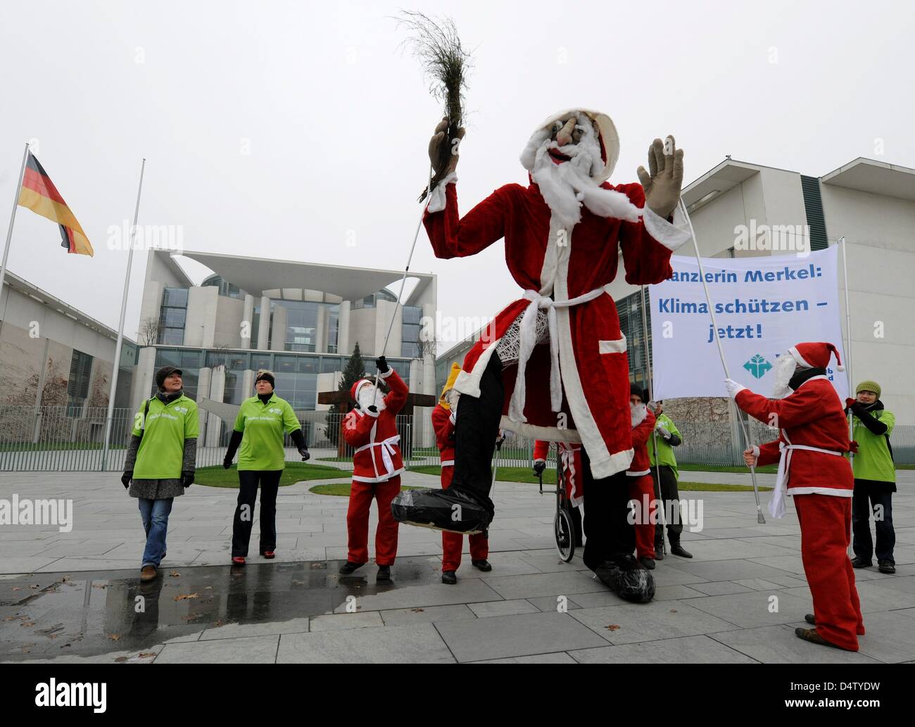 Activists of 'Verkehrsclub Deutschland' with an oversized Santa Claus ...