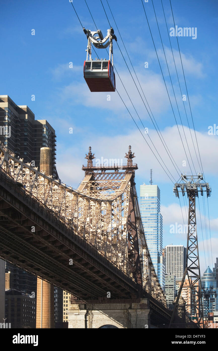 Chairlift over urban bridge Stock Photo - Alamy