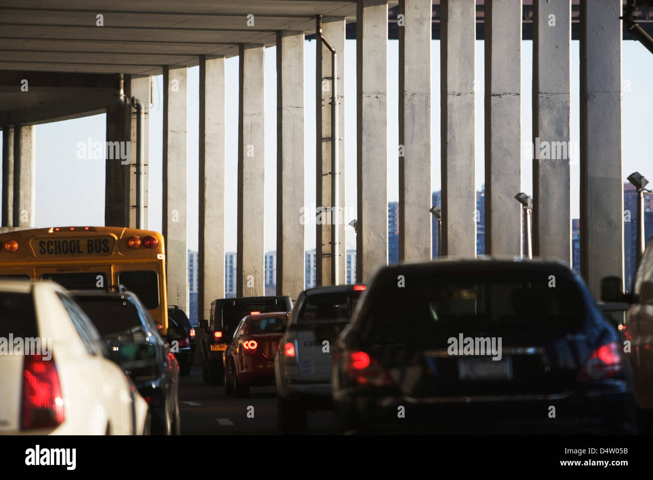 Traffic under urban overpass Stock Photo - Alamy