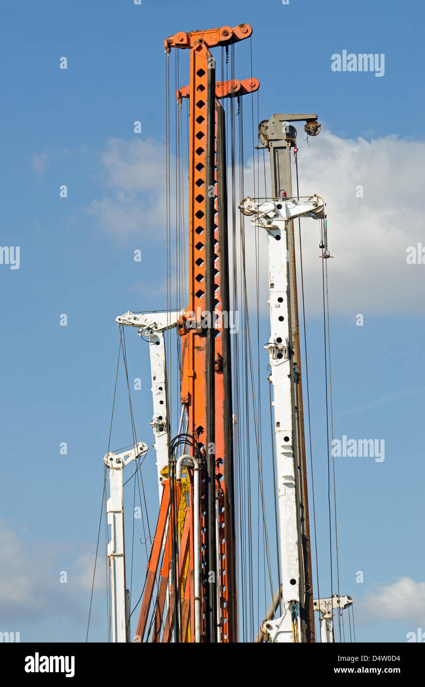 Vertical cranes against blue sky Stock Photo - Alamy