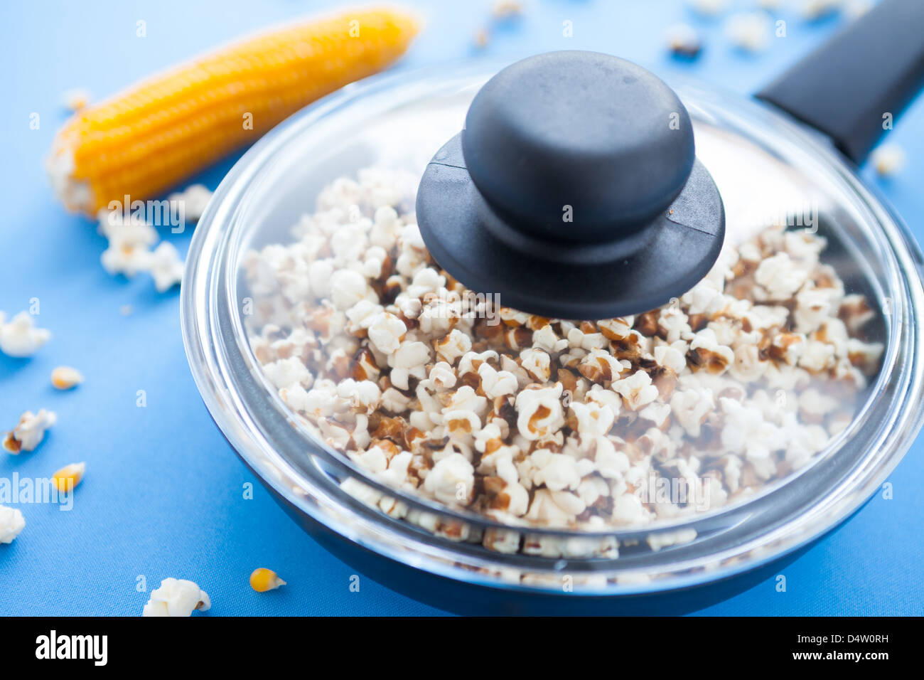 delicious homemade popcorn in a pan under the transparent cover, food ...