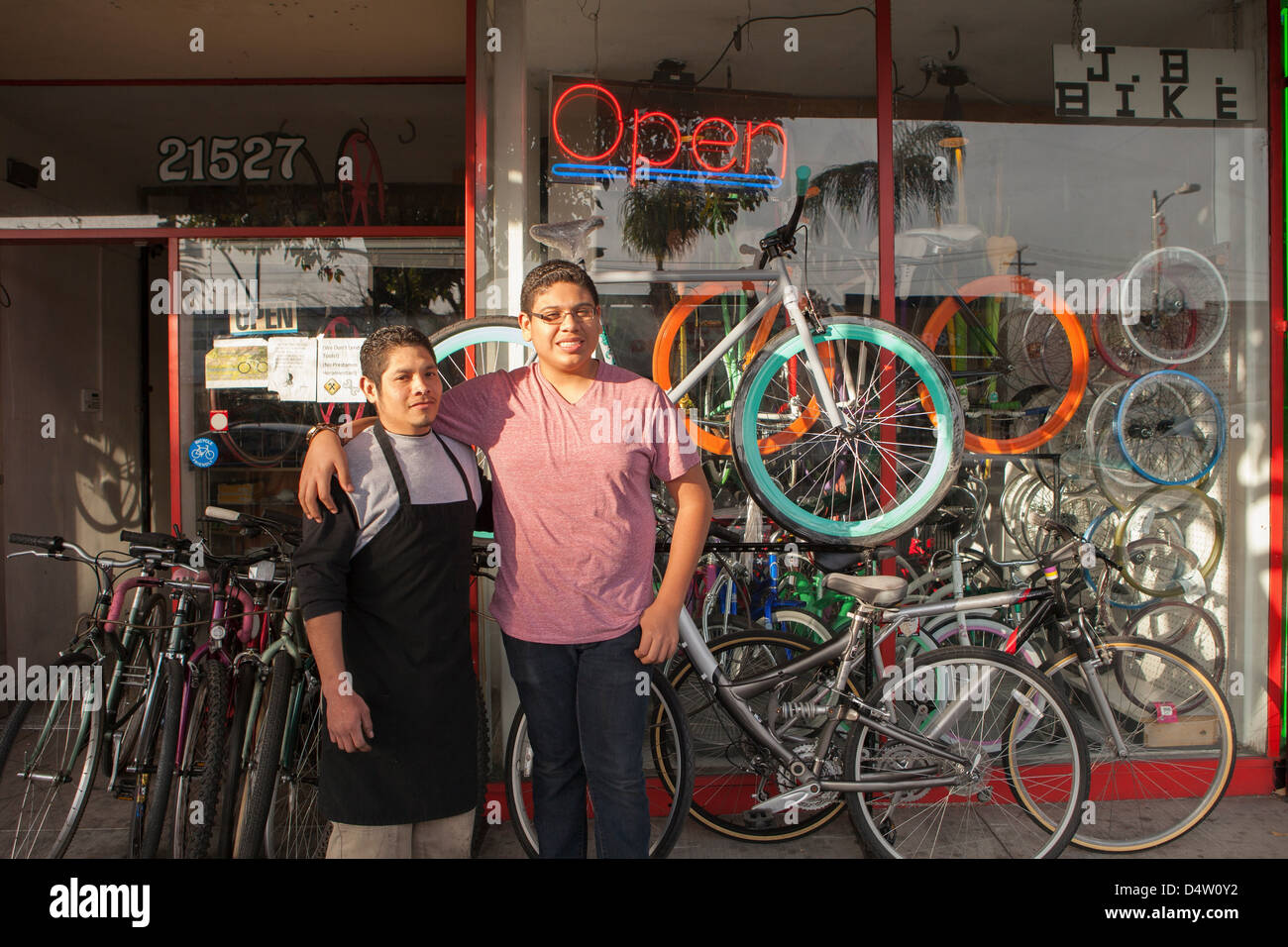 Mechanics outside in bicycle shop Stock Photo - Alamy