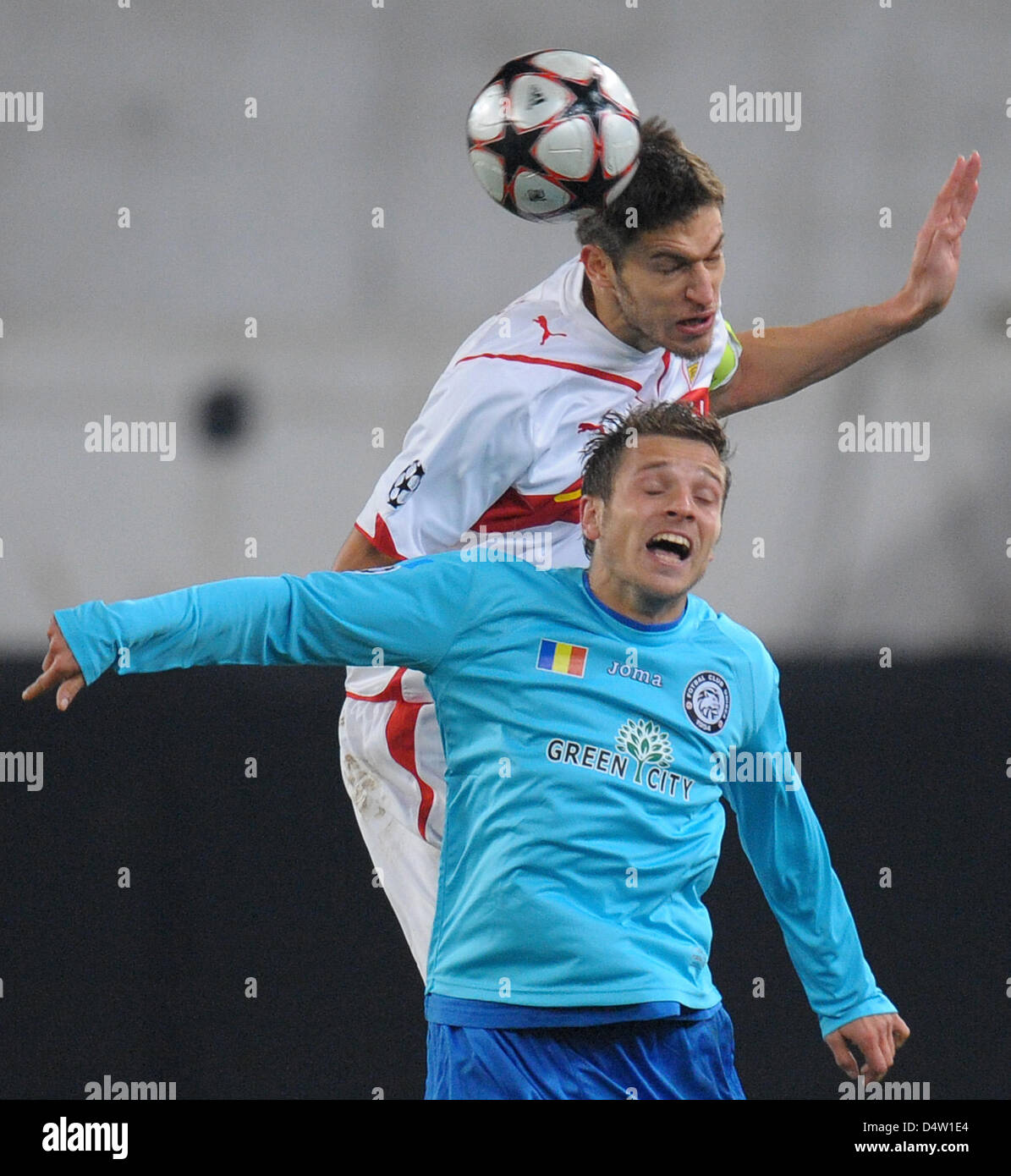 Stuttgart's Matthieu Delpierre (above) and Urziceni's Tiberiu Balan vie ...