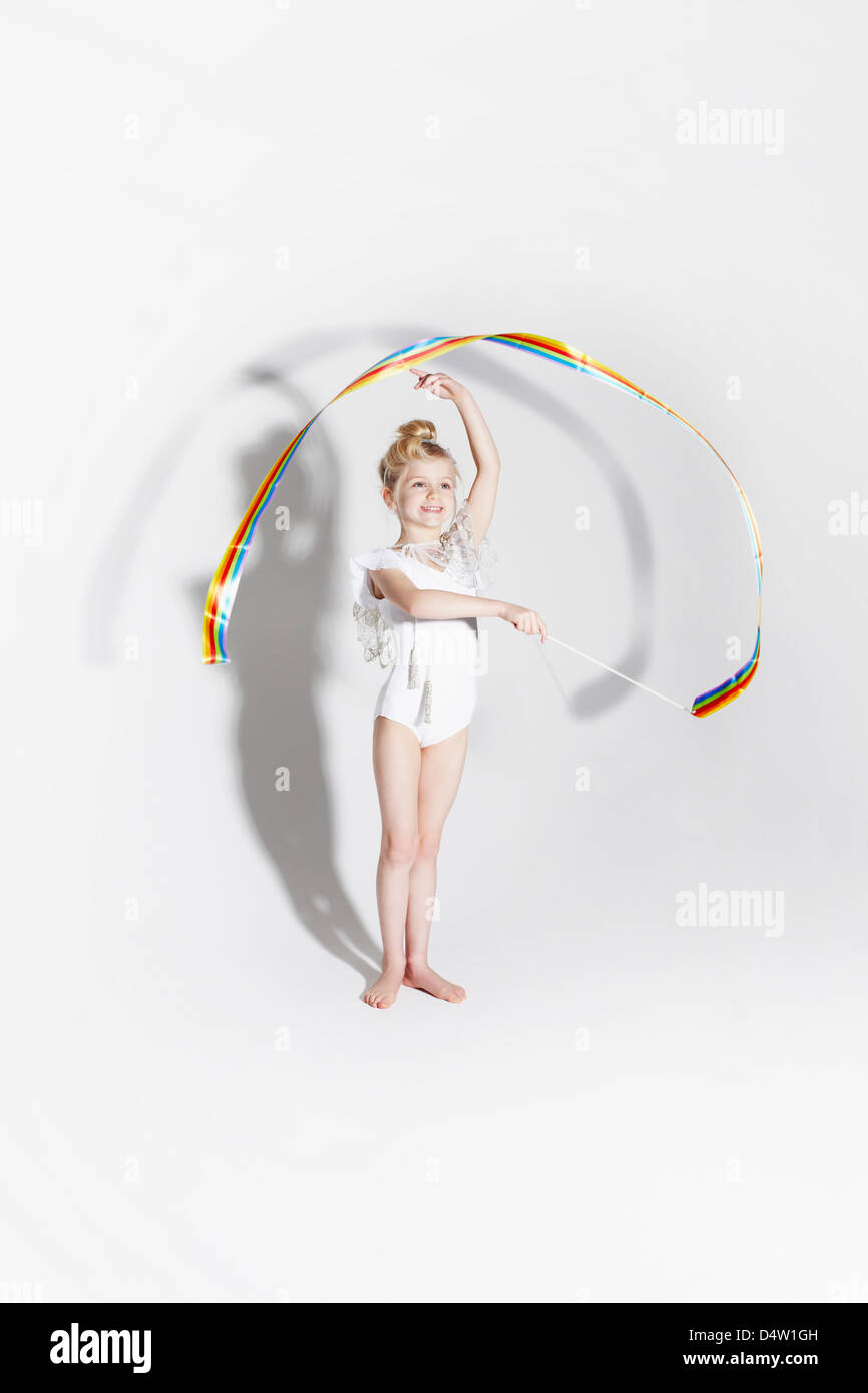 Girl playing with ribbon streamers Stock Photo - Alamy