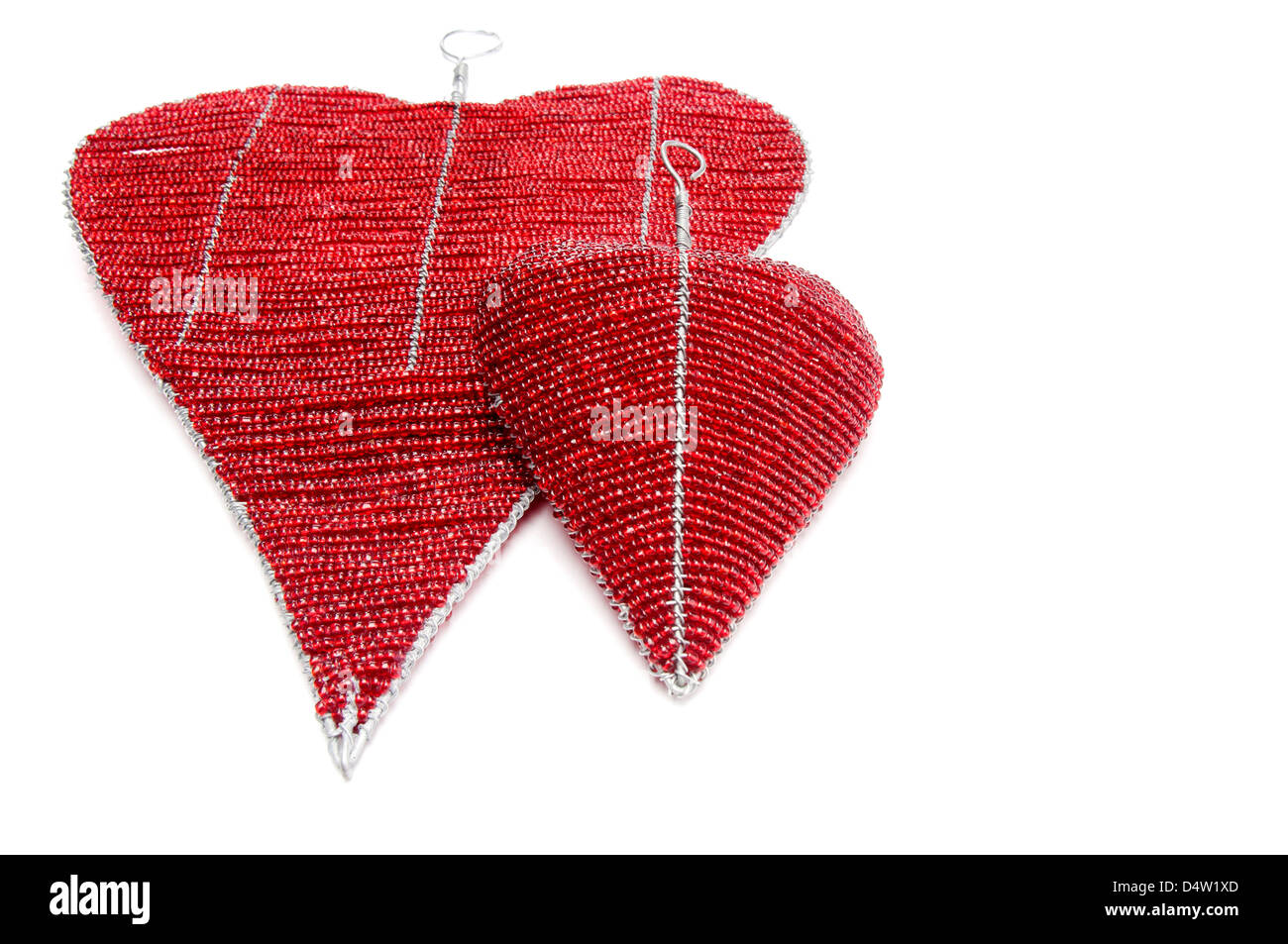 Two large red beaded hearts resting on top of each other Stock Photo ...
