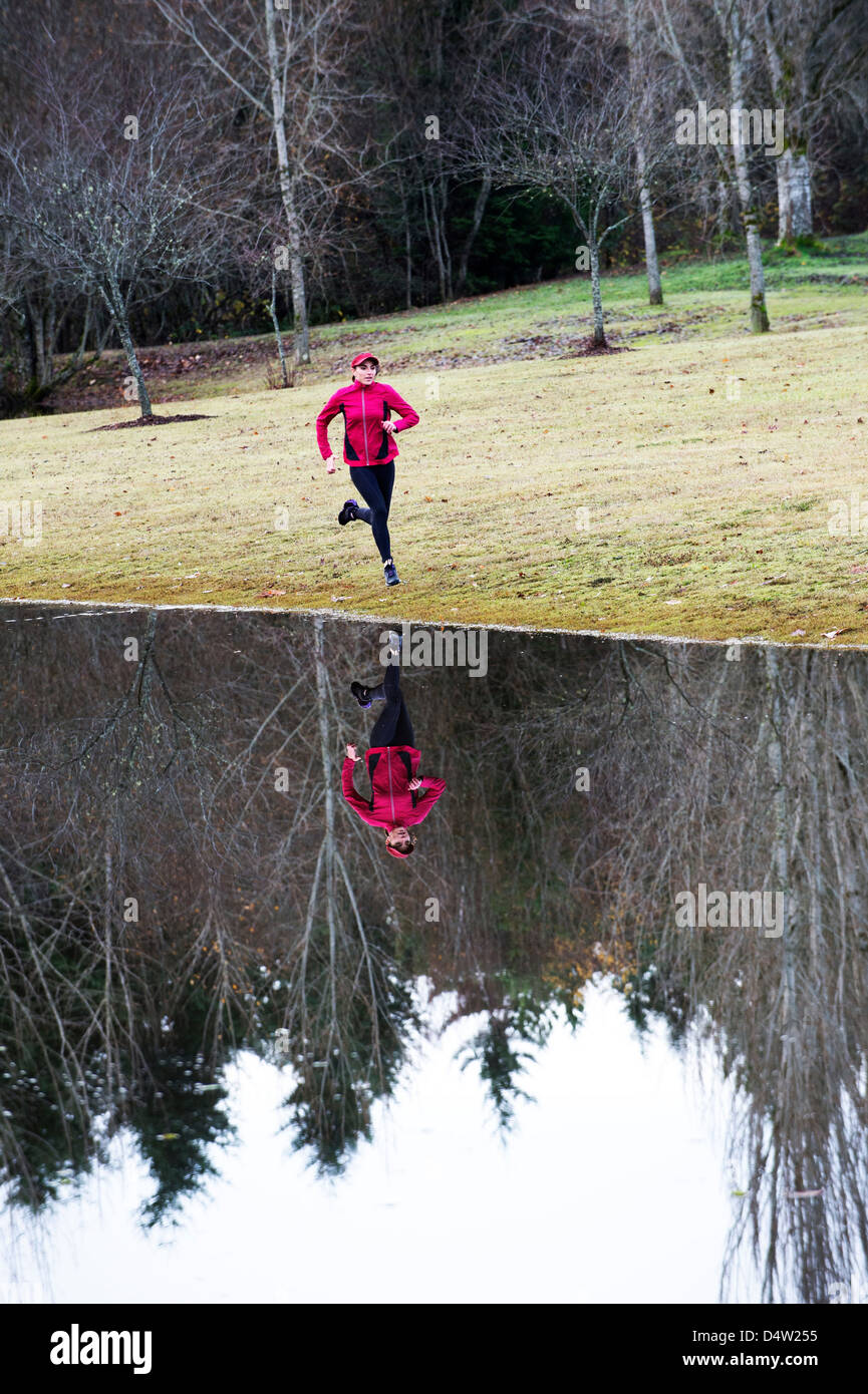 Woman jogging on lake hi-res stock photography and images - Alamy