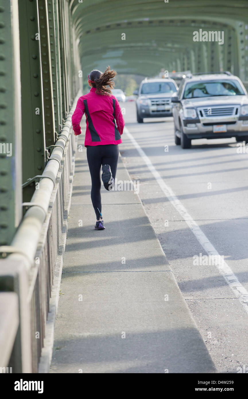 Person running on bridge in hi-res stock photography and images - Alamy
