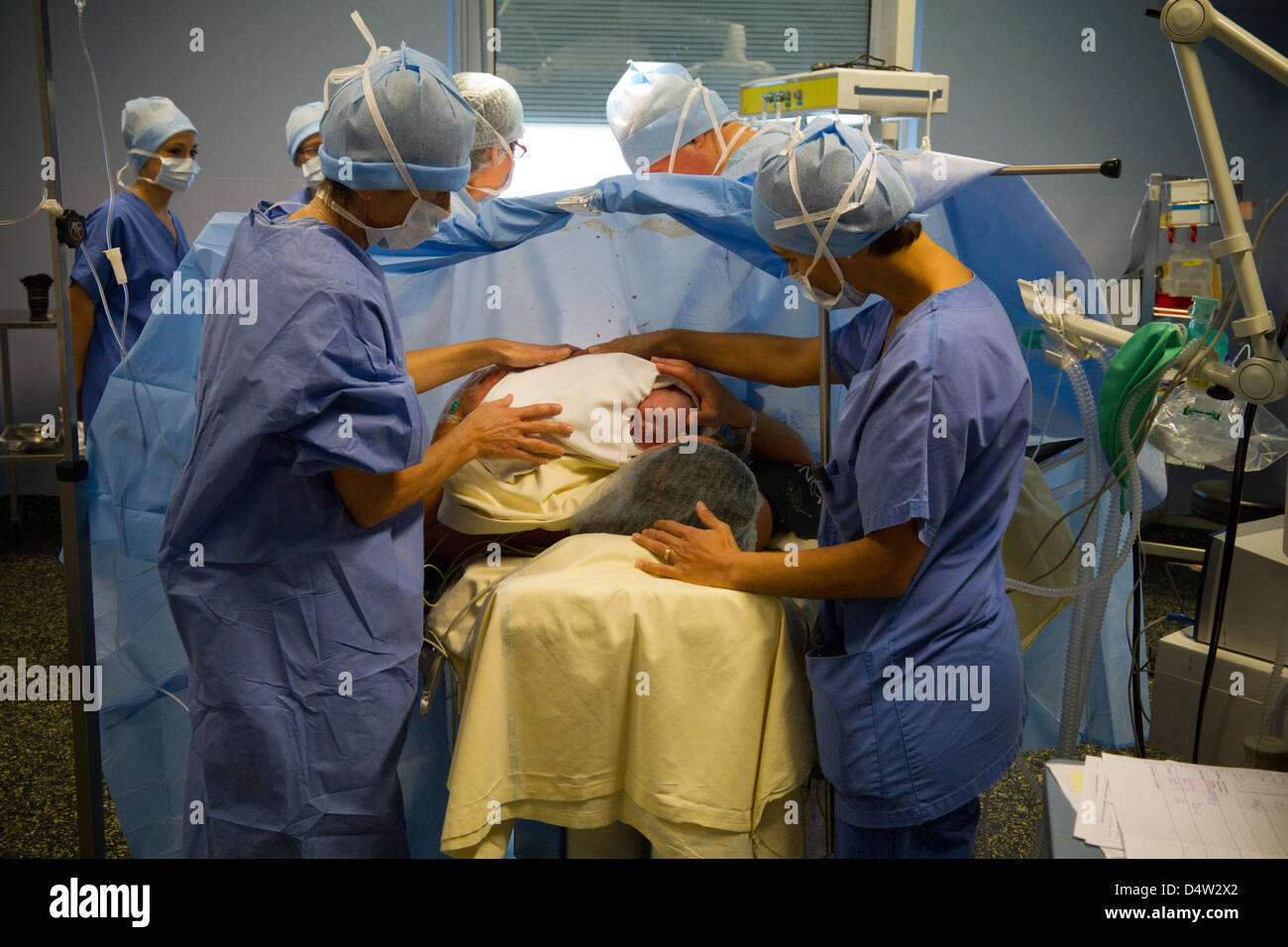 Cesarean in a hospital. a newborn in operating room Stock Photo - Alamy