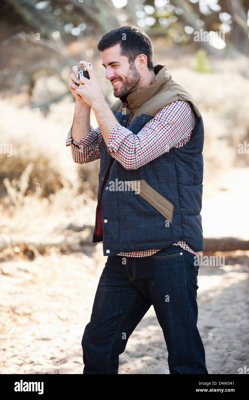 Man taking picture outdoors Stock Photo - Alamy