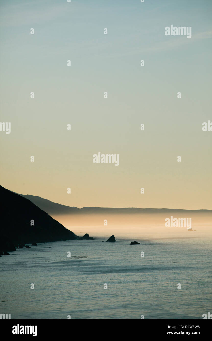 Fog rolling over ocean Stock Photo - Alamy