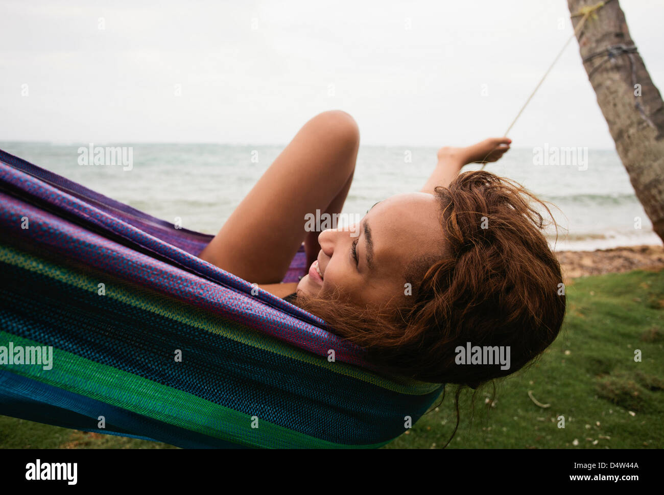 Woman on hammock in vacation hi-res stock photography and images - Alamy