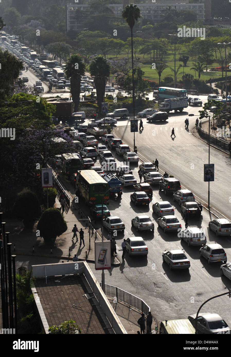 Cars are caught up in a traffic jam in a road in the city centre of ...