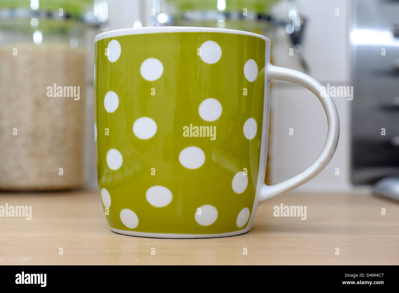 green mug with white spots Stock Photo - Alamy