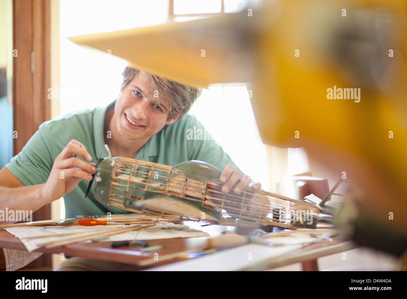 Man working on model airplane Stock Photo - Alamy