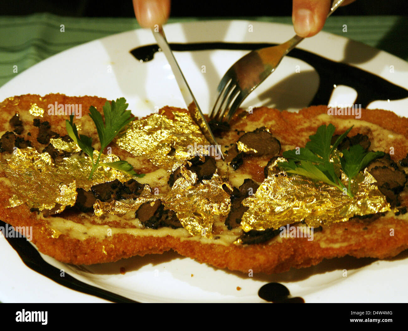 A 'Schnitzel' covered with 24-carat gold foil at a self-service ...