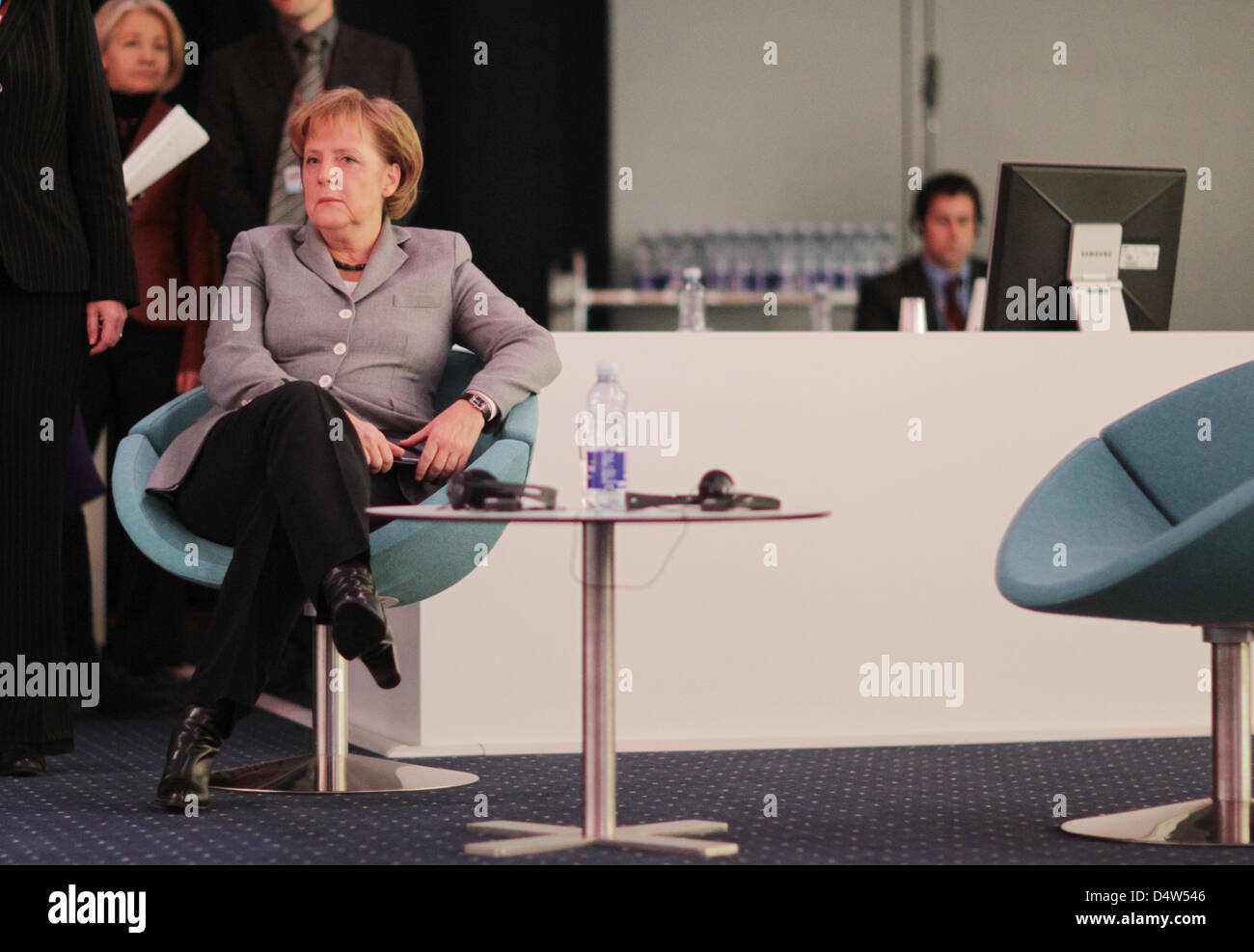 German Chancellor Angela Merkel sits in a chair at the World Climate ...