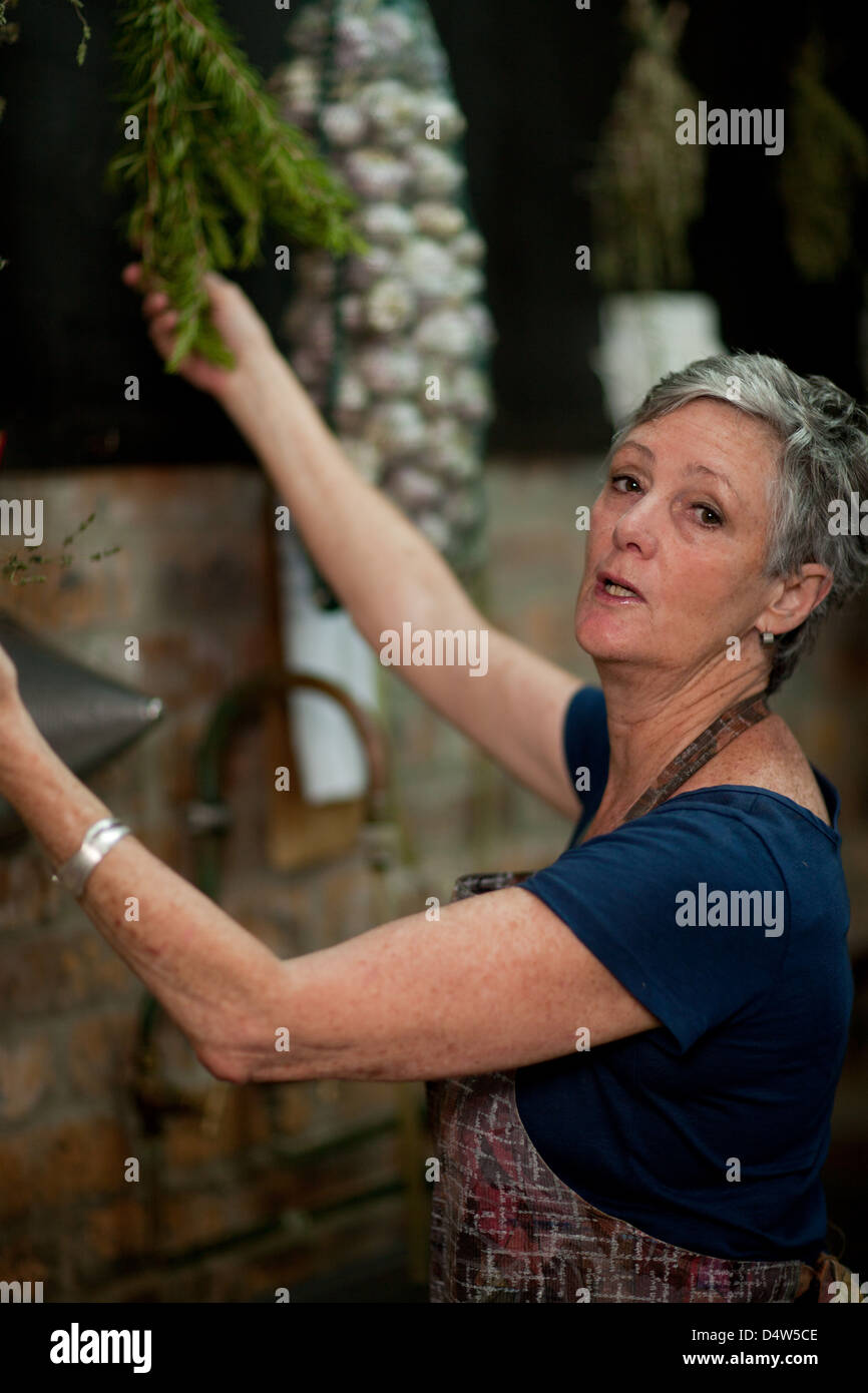 Older woman holding tree leaves Stock Photo - Alamy