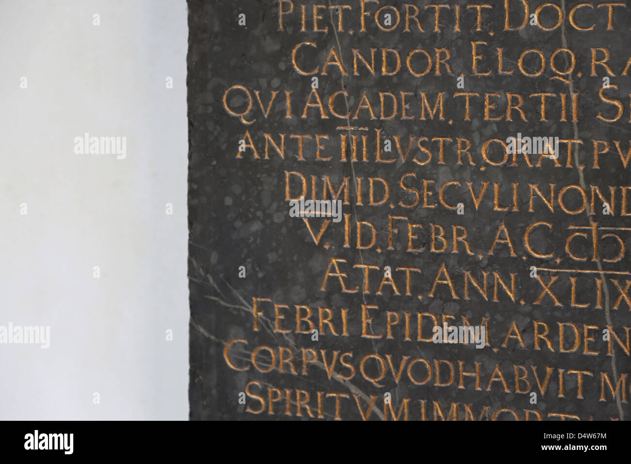 A tombstone engraved in Latin mounted inside the Basel Cathedral ...