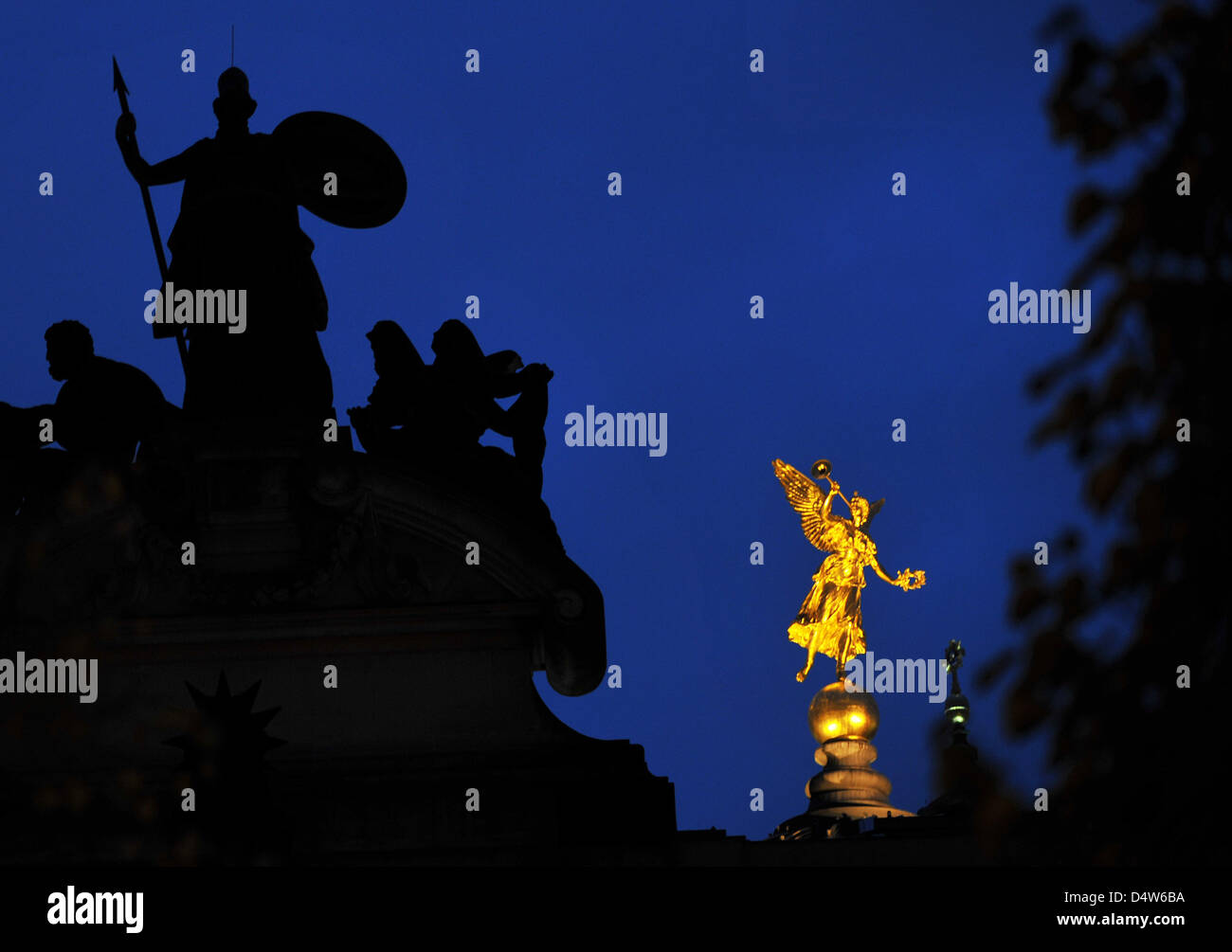 The illuminated sculpture of ?Fama?, goddess of fame, shines in gold ...
