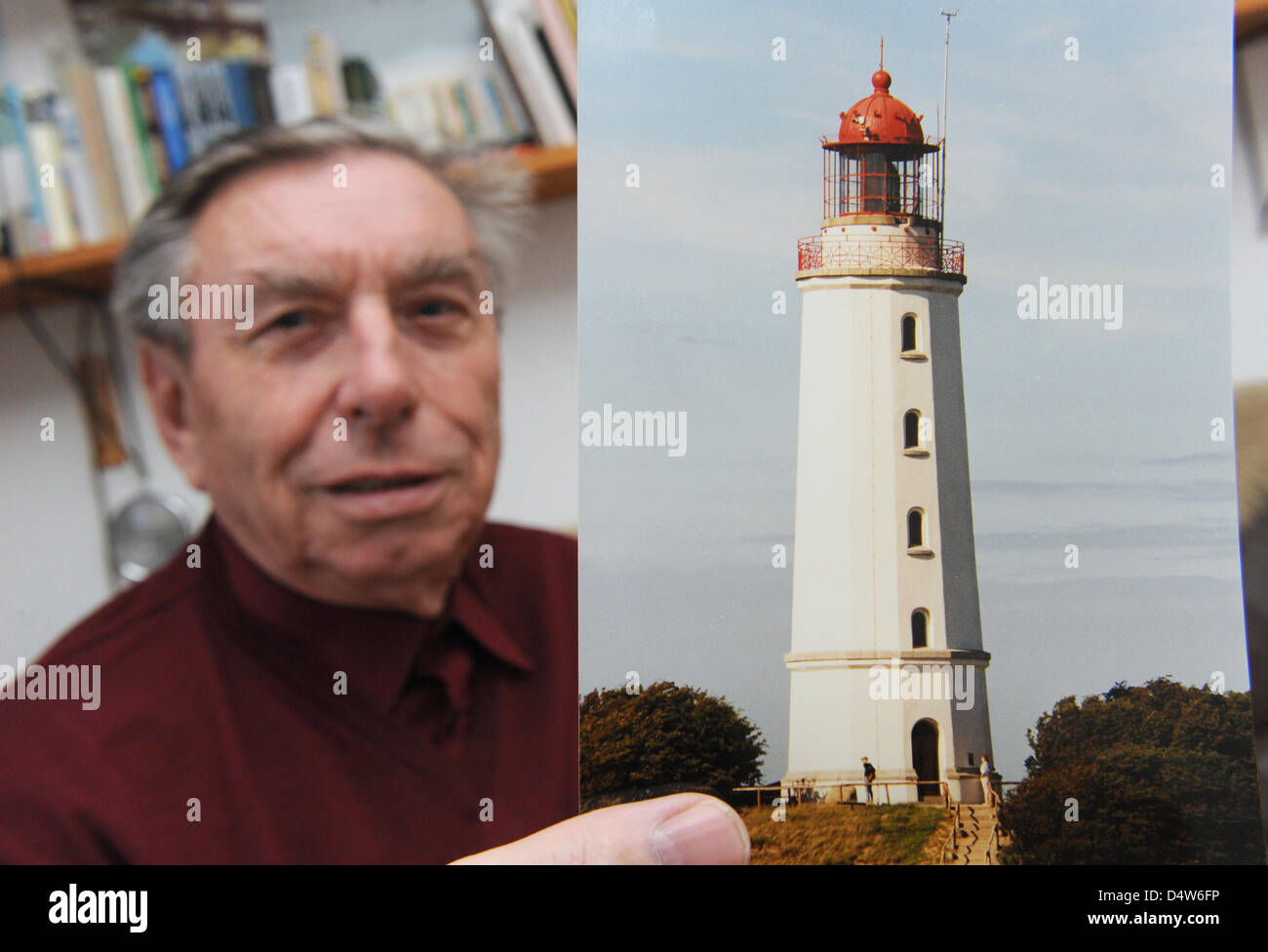Former lighthouse keeper Walter Hoerenz presents a photography of the ...