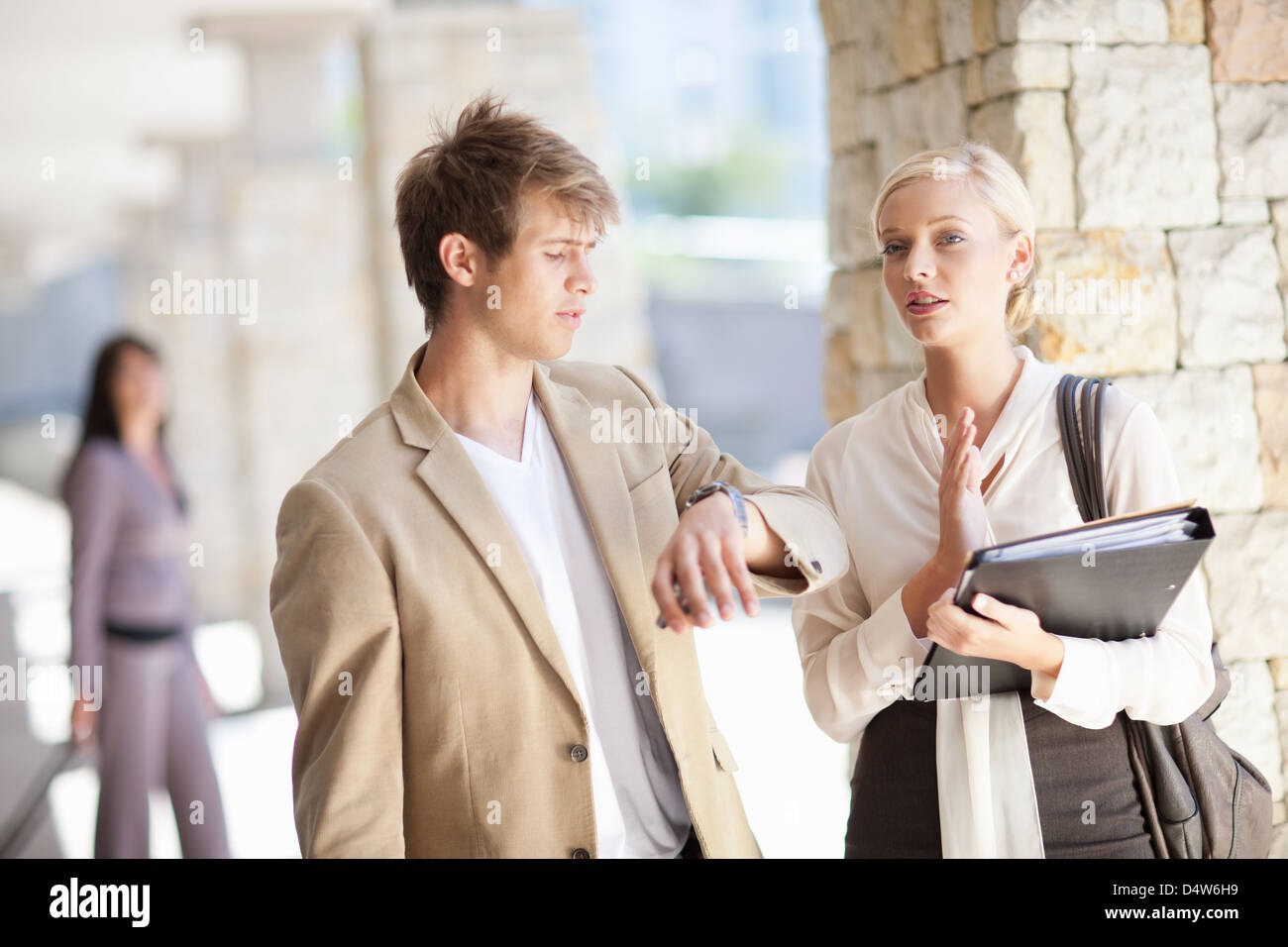 Business people talking outdoors Stock Photo - Alamy