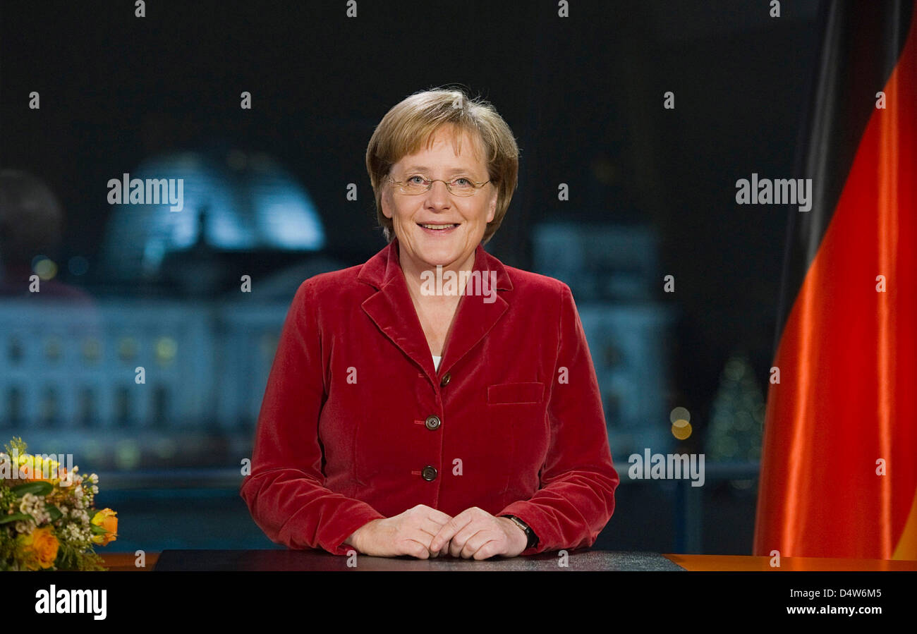 German Chancellor Angela Merkel seen behind her desk against the ...