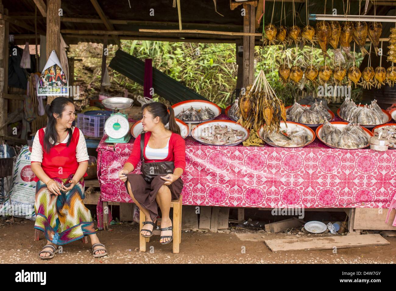 March 9, 2013 - Houaymor, Vientiane, Laos - Women wait for customers at ...