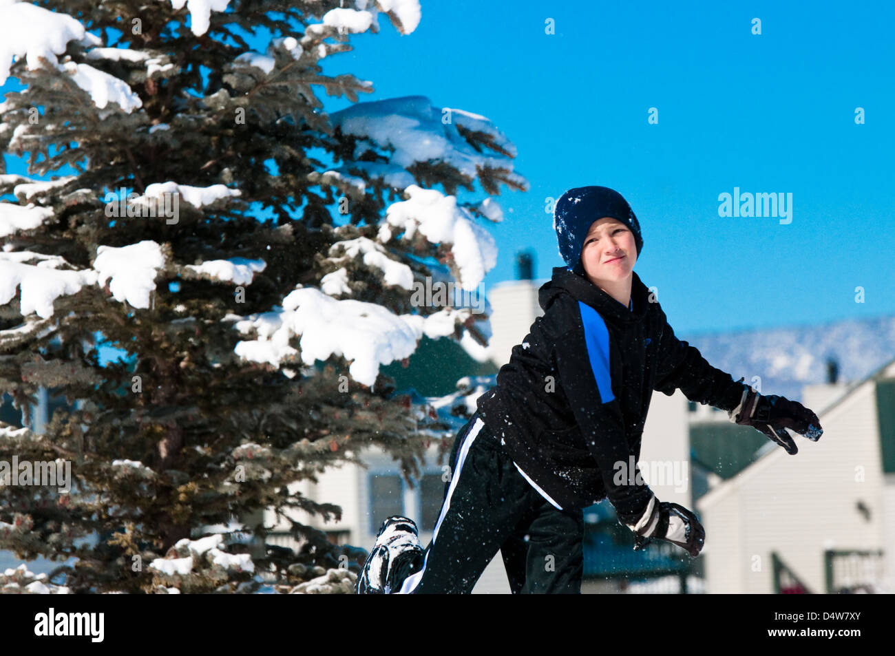 A child throwing a snowball Stock Photo - Alamy