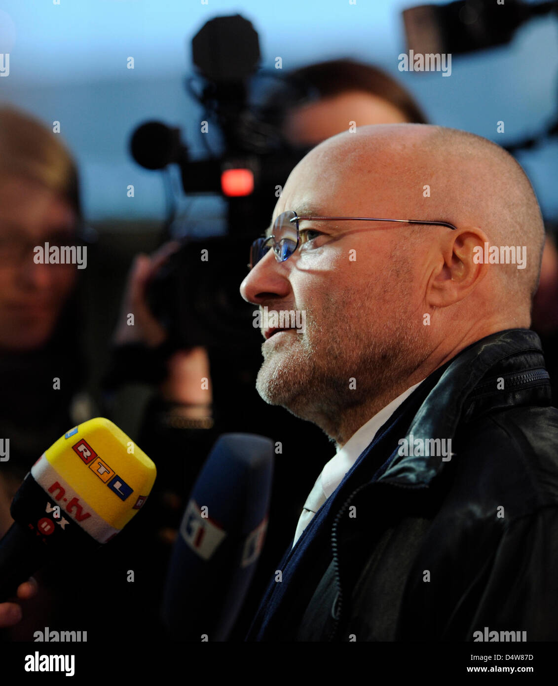 British singer Phil Collins delivers an interview as he arrives for the ...