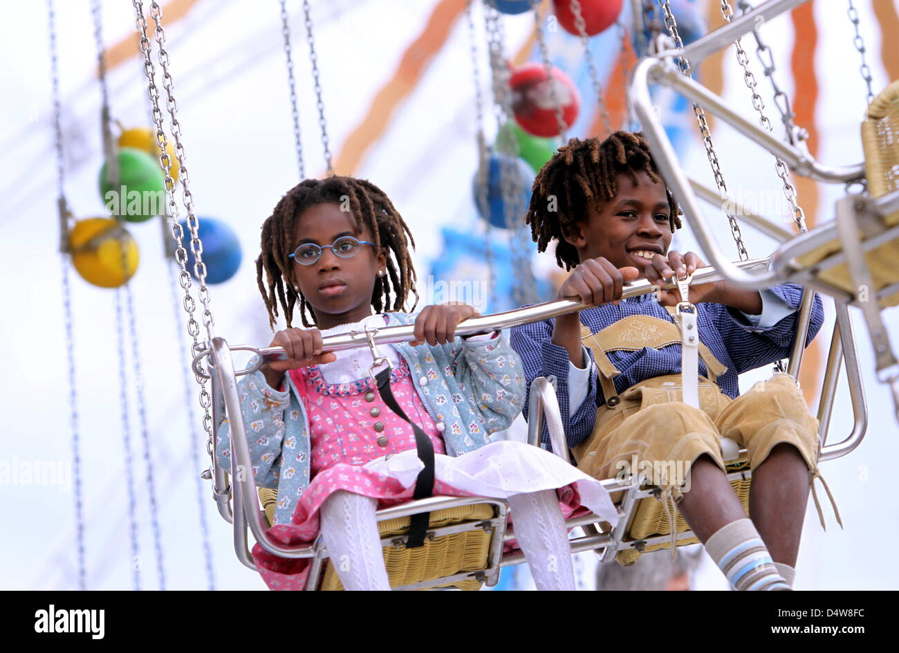 Children ride a roundabout as the 2010 Oktoberfest kicks off in Munich ...