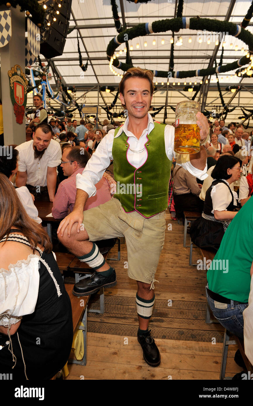 German folk singer Florian Silbereisen poses with a Mass of beer as the ...