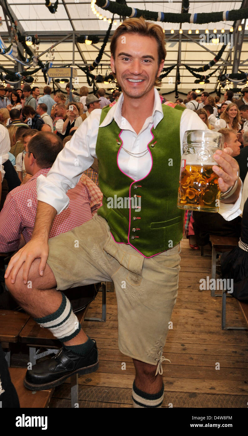 German folk singer Florian Silbereisen poses with a Mass of beer as the ...