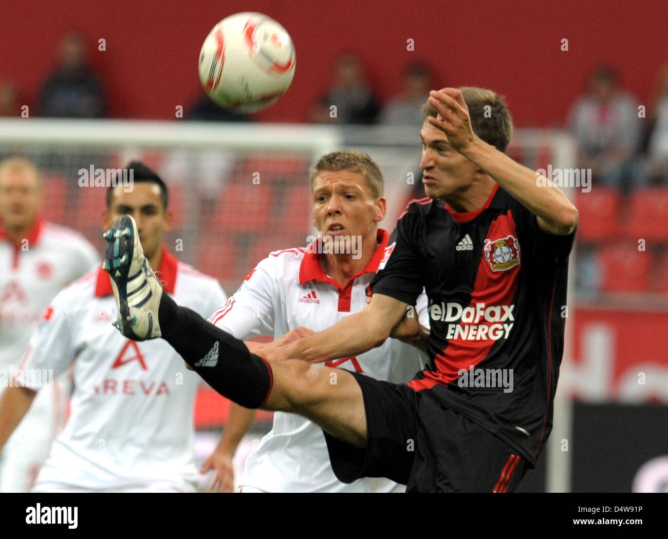 Leverkusen's Daniel Schwaab and Nuernberg's Mike Frantz vie for the ...